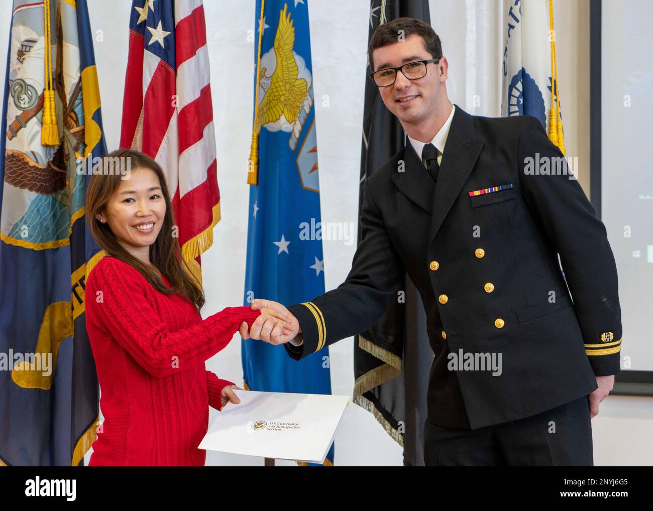 YOKOSUKA, Japan (Jan. 30, 2023) — Reiko Lutke receives a certificate of ...