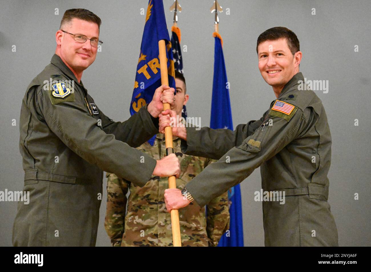 Col. Joseph Bonner, 314th Operations Group commander (left), hands the ...