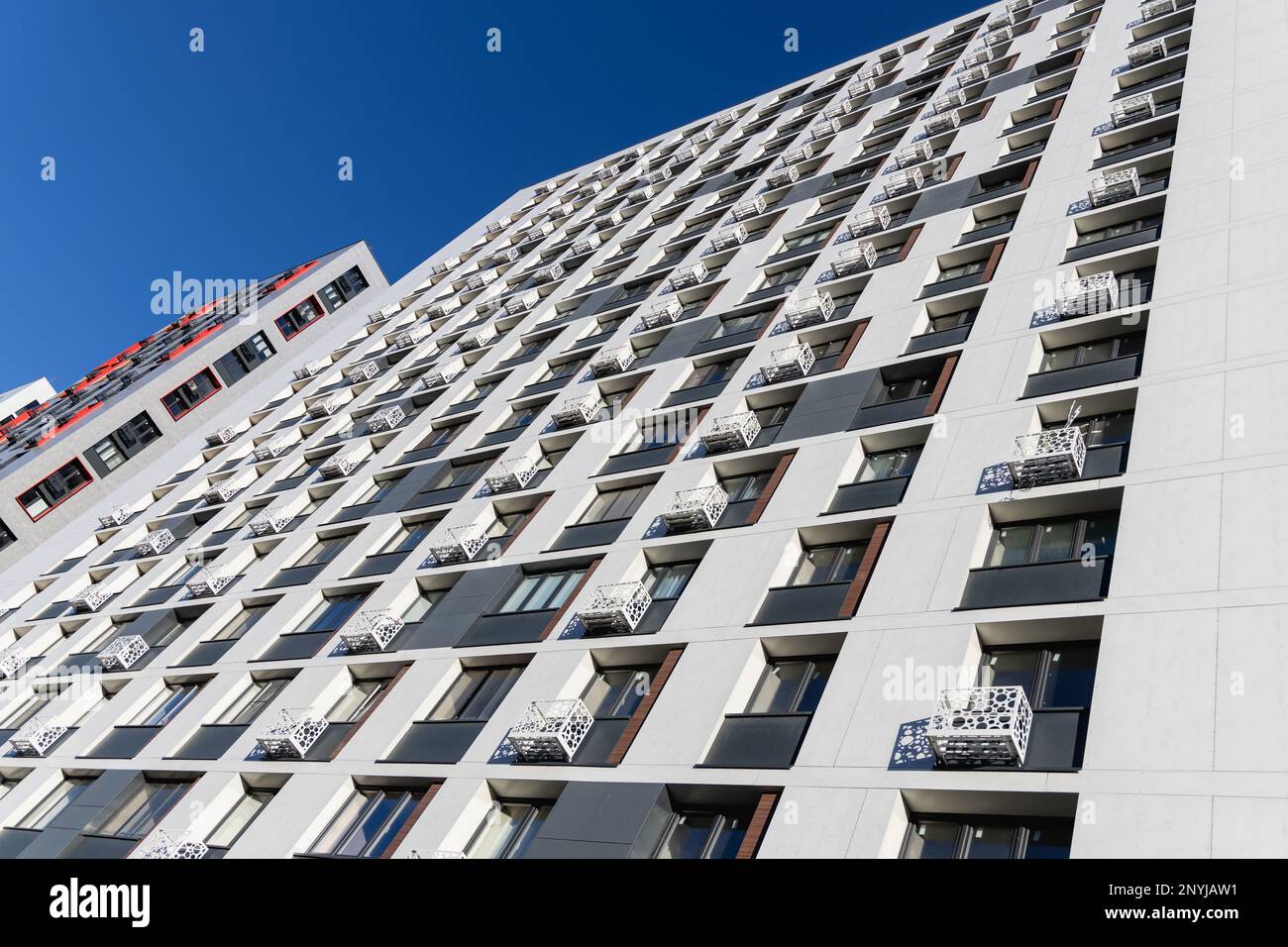 The facade of the new residential high-rise buildings against the sky ...