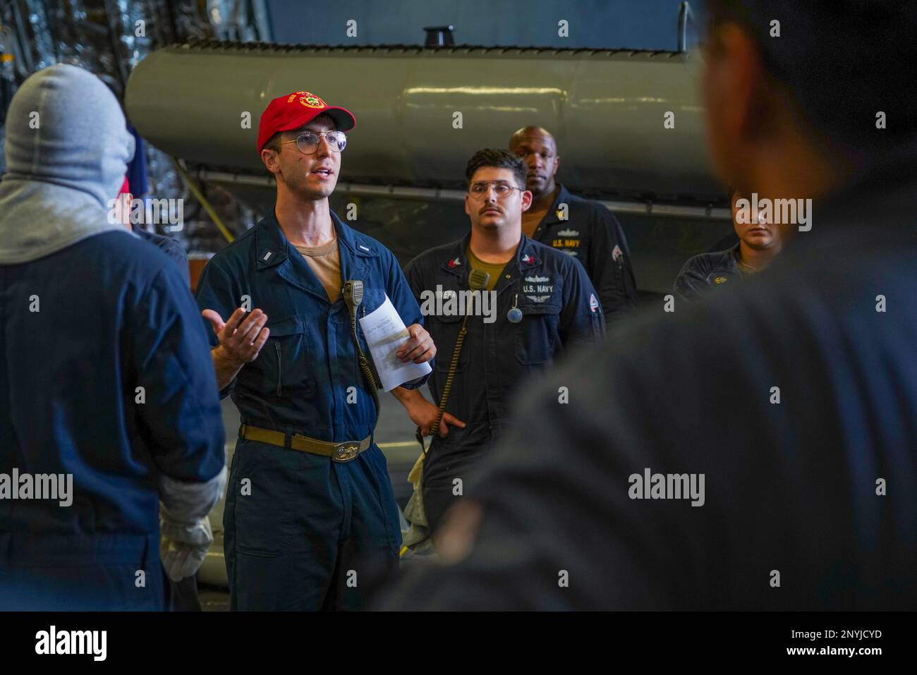 SINGAPORE (Jan. 21, 2023) Lt. j.g. Brandon Gregrow, second from the ...