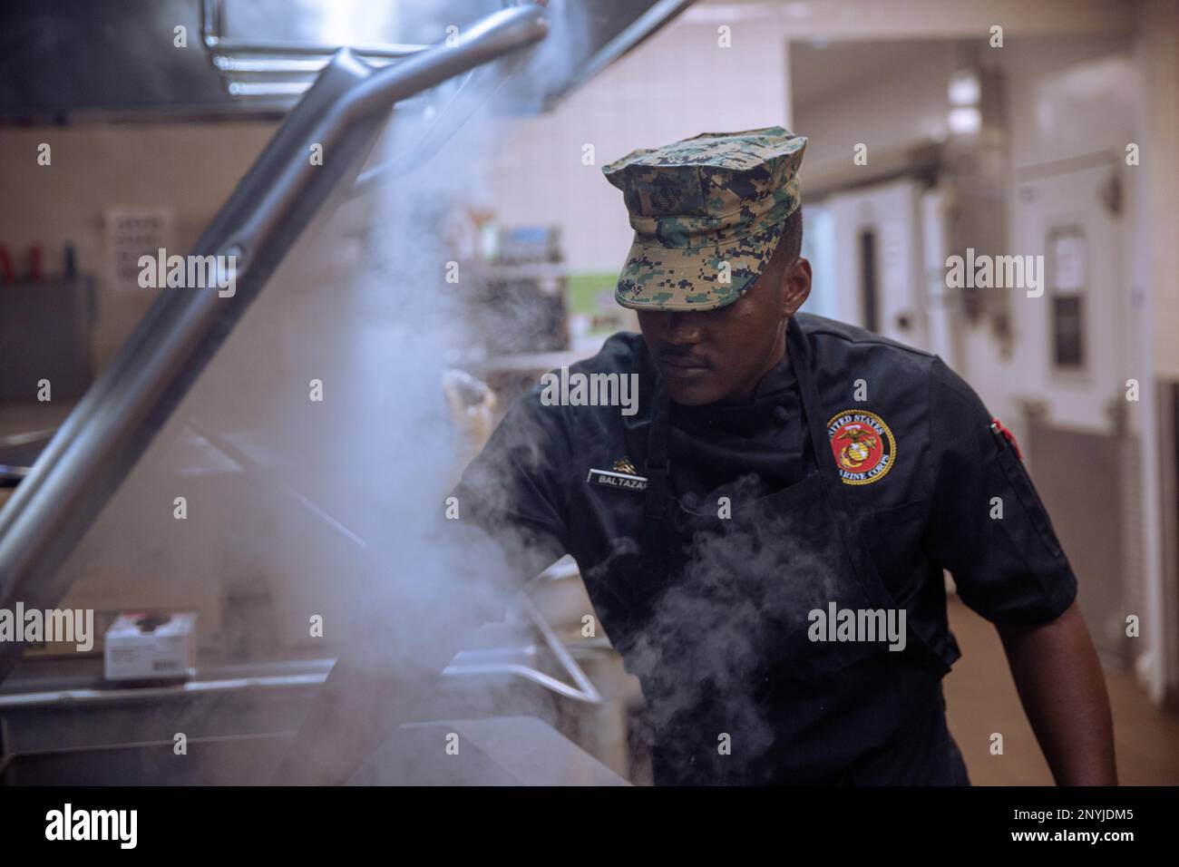 U.S. Marine Corps Cpl. Emerson Baltazar, a food service specialist with ...