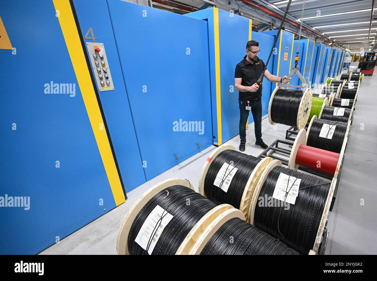 Stuttgart, Germany. 02nd Mar, 2023. An employee of cable manufacturer ...