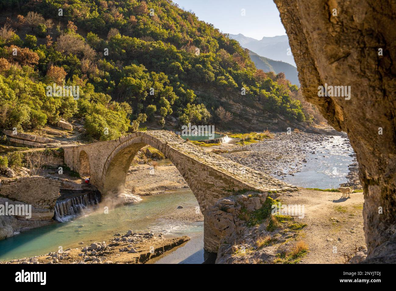 Old stone bridge with arch shape photographed during sunset. photo ...