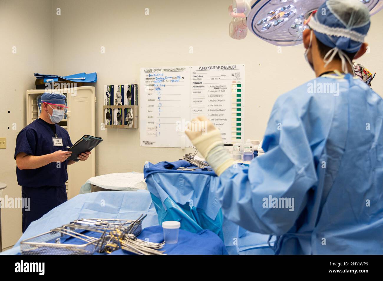 Instructors act as surgeons during a mock surgery while 68D operating ...