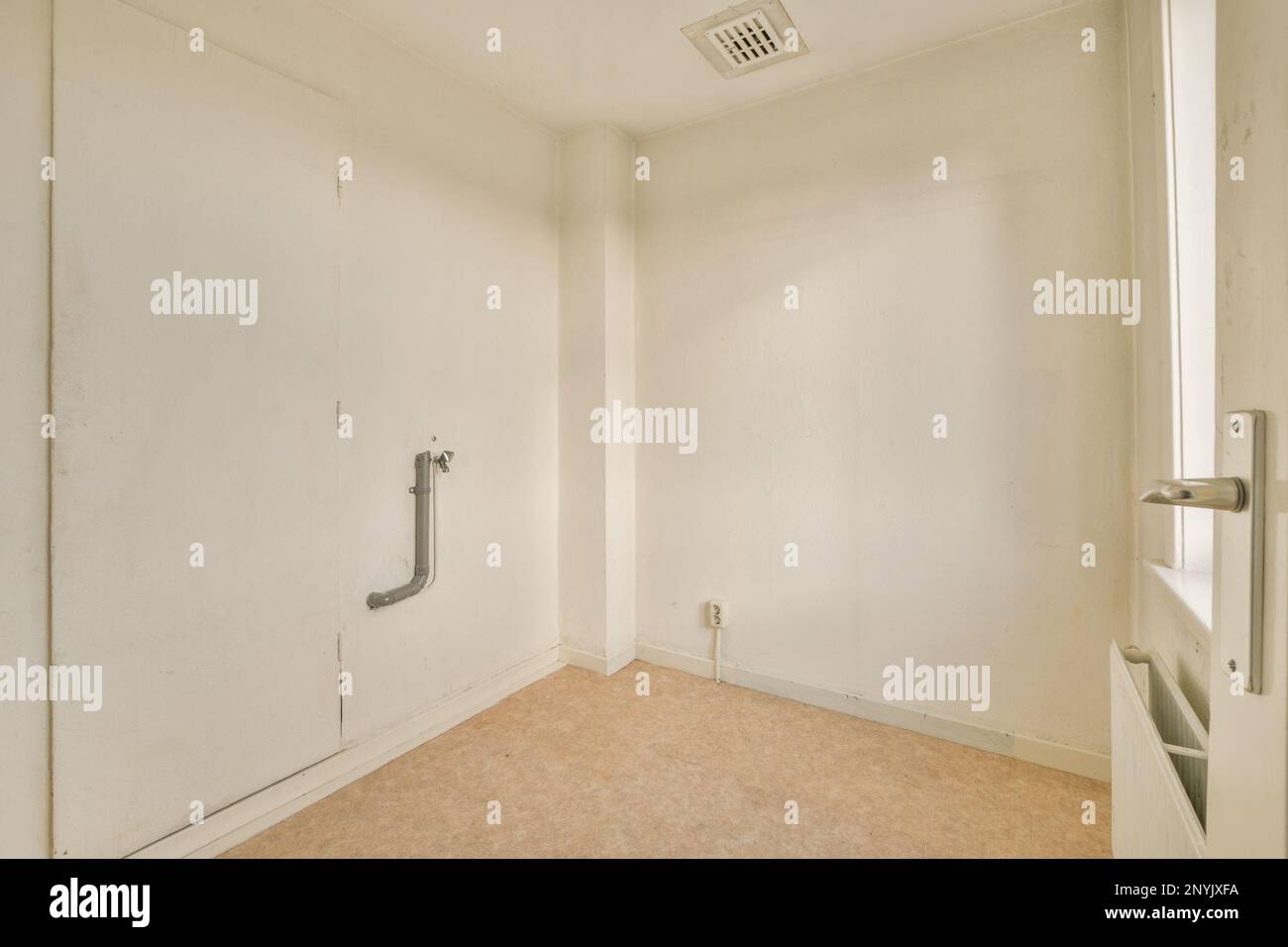 an empty room with white walls and no one door on the other wall, as if ...