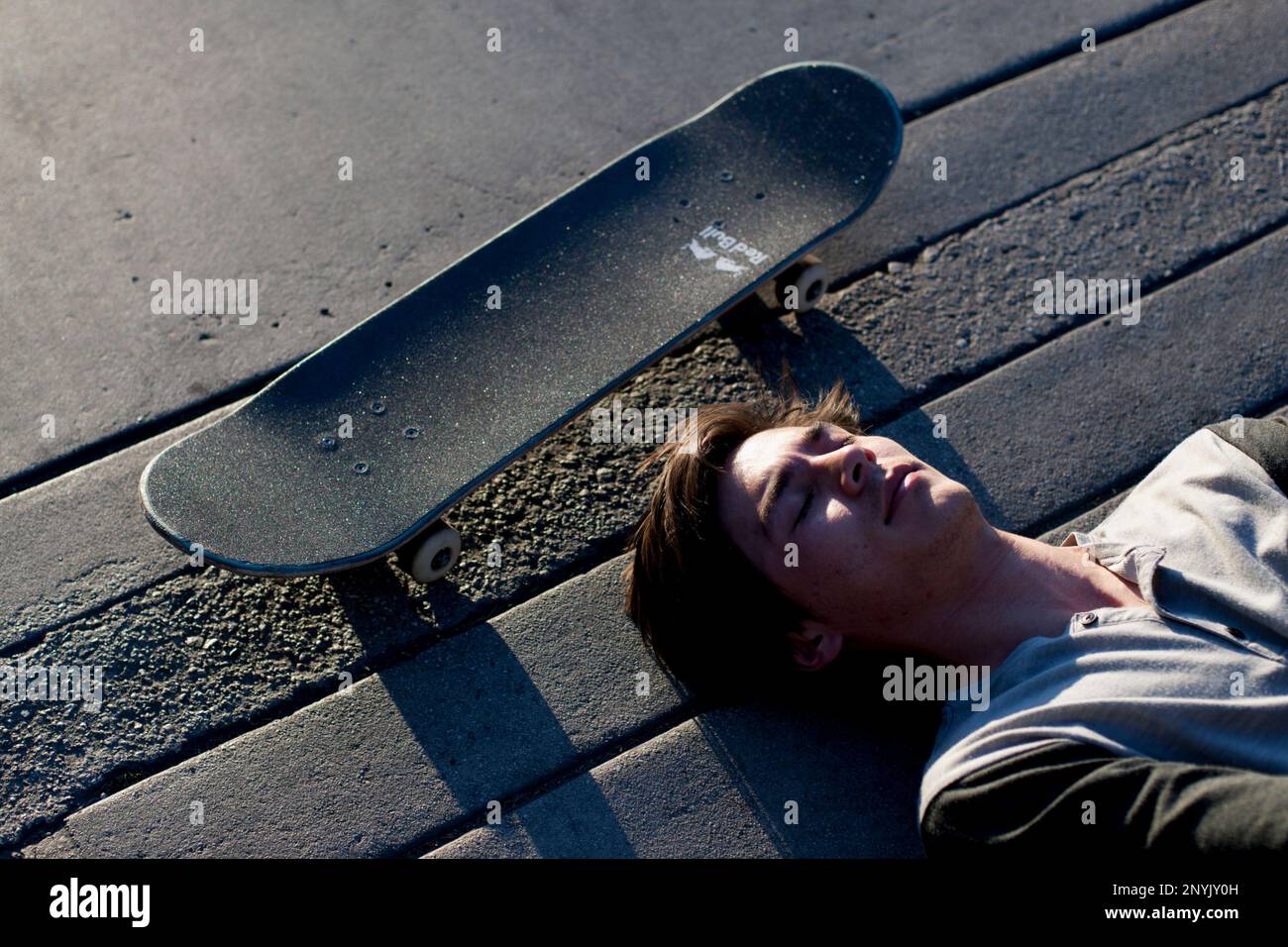 Denny Pham lies on the ground after a skate session in Sun Valley in ...