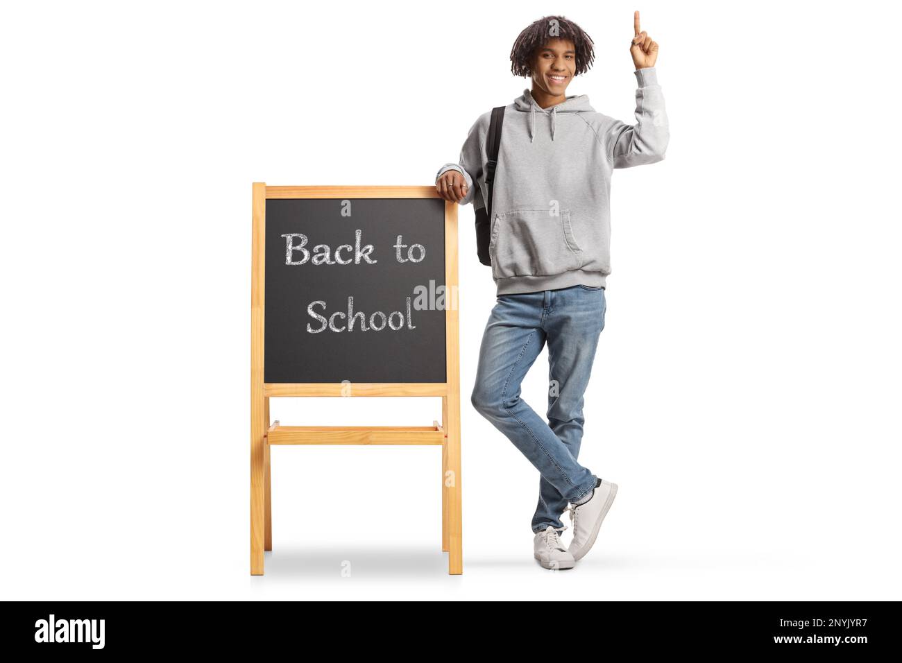 African american male student leaning on a blackboard with text back to ...