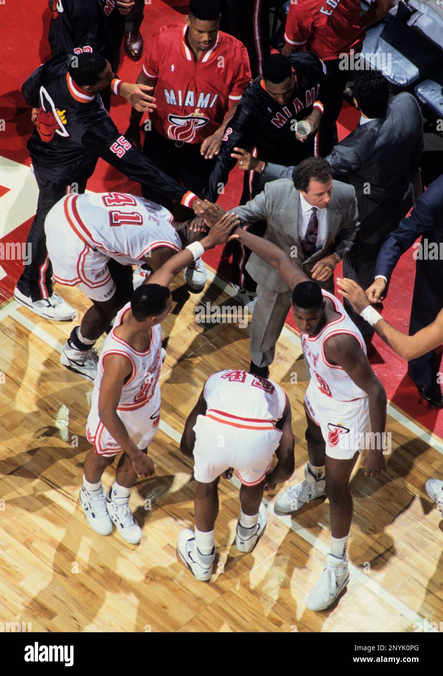 Miami Heat coach Ron Rothstein huddles with the team before play in an ...