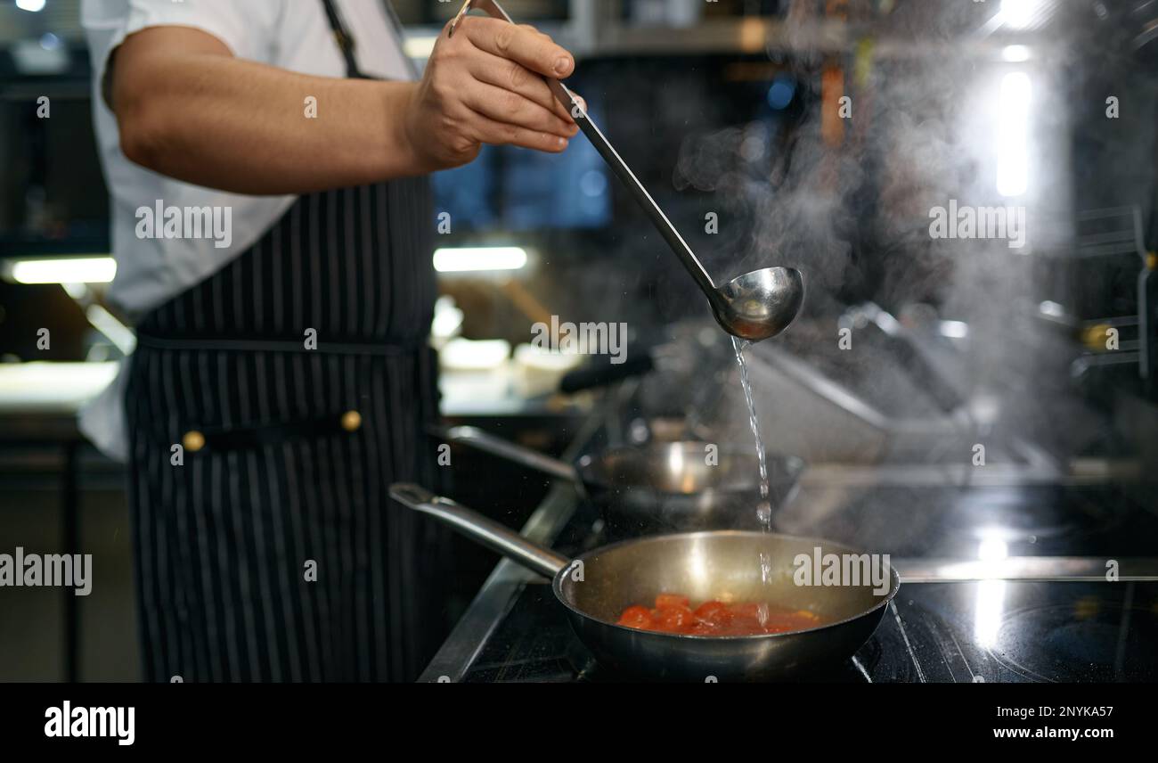 Adding wine sauce cooking hi-res stock photography and images - Alamy