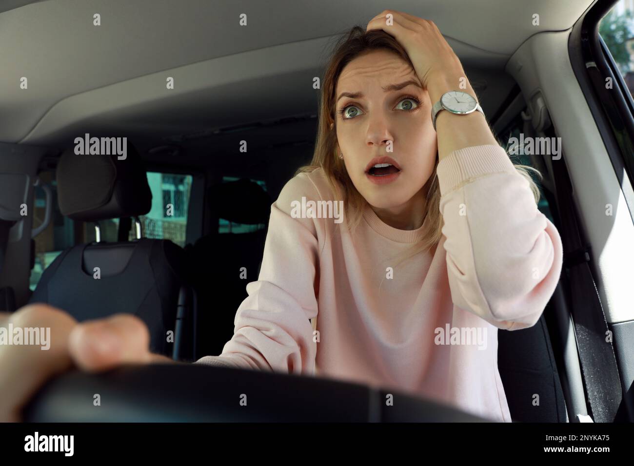 Stressed woman in driver's seat of modern car Stock Photo - Alamy