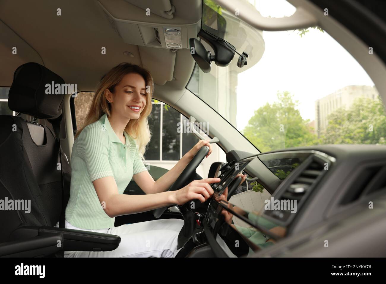 Young woman using navigation system while driving car Stock Photo - Alamy Young woman using navigation system while driving car Stock Photo - Alamy