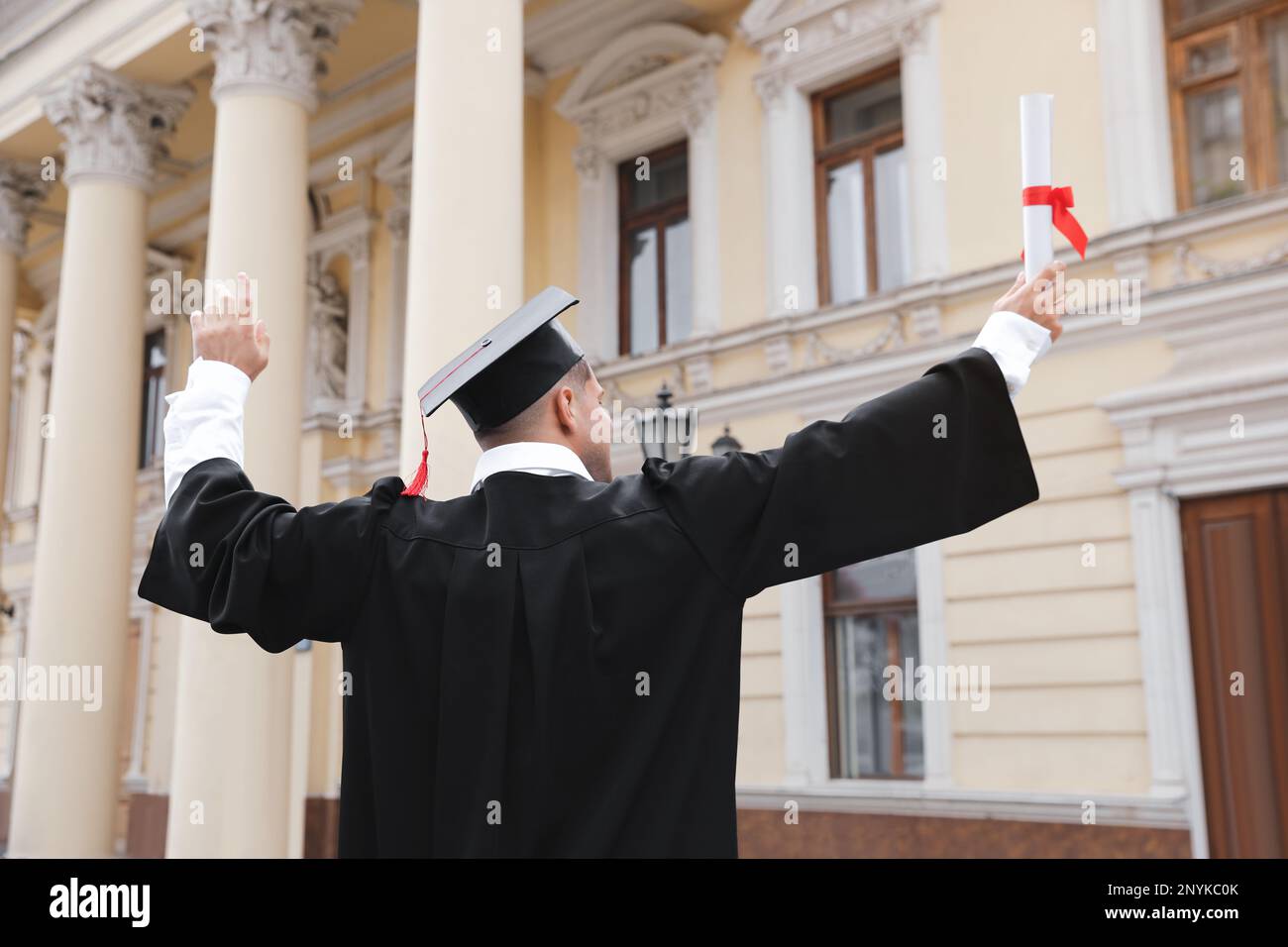 Student with diploma after graduation ceremony outdoors Stock Photo - Alamy