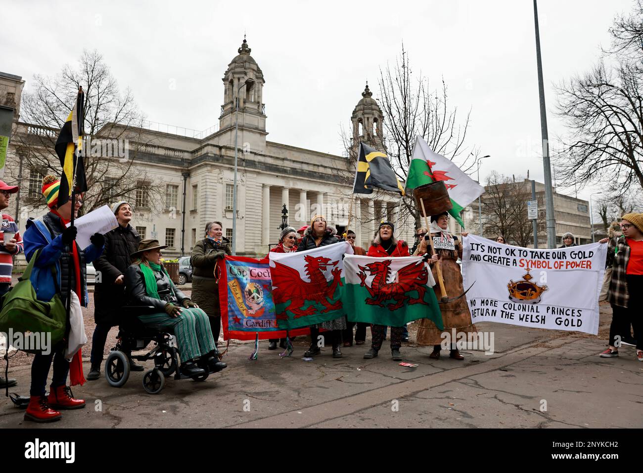 Cardiff, UK. 01st Mar, 2023. Parade participants hold Welsh flags in ...
