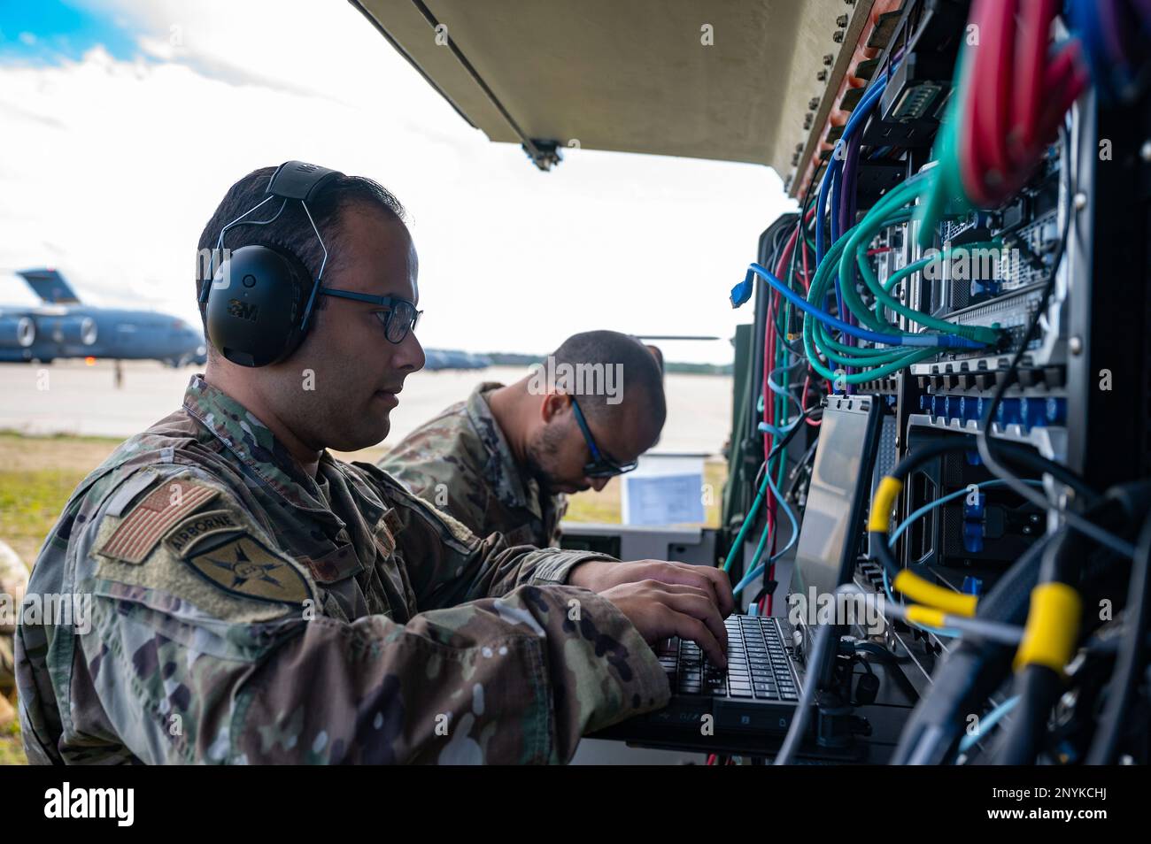 U.S. Air Force Airmen set up a mobile communications antenna for a ...