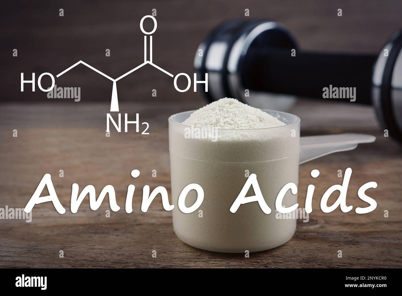 Measuring scoop of amino acids powder on wooden table, closeup Stock ...