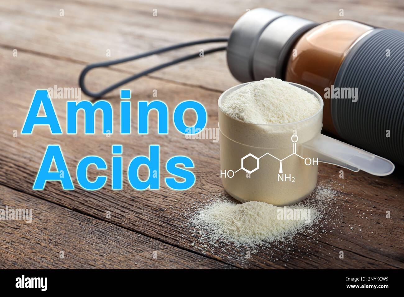 Measuring scoop of amino acids powder on wooden table Stock Photo - Alamy