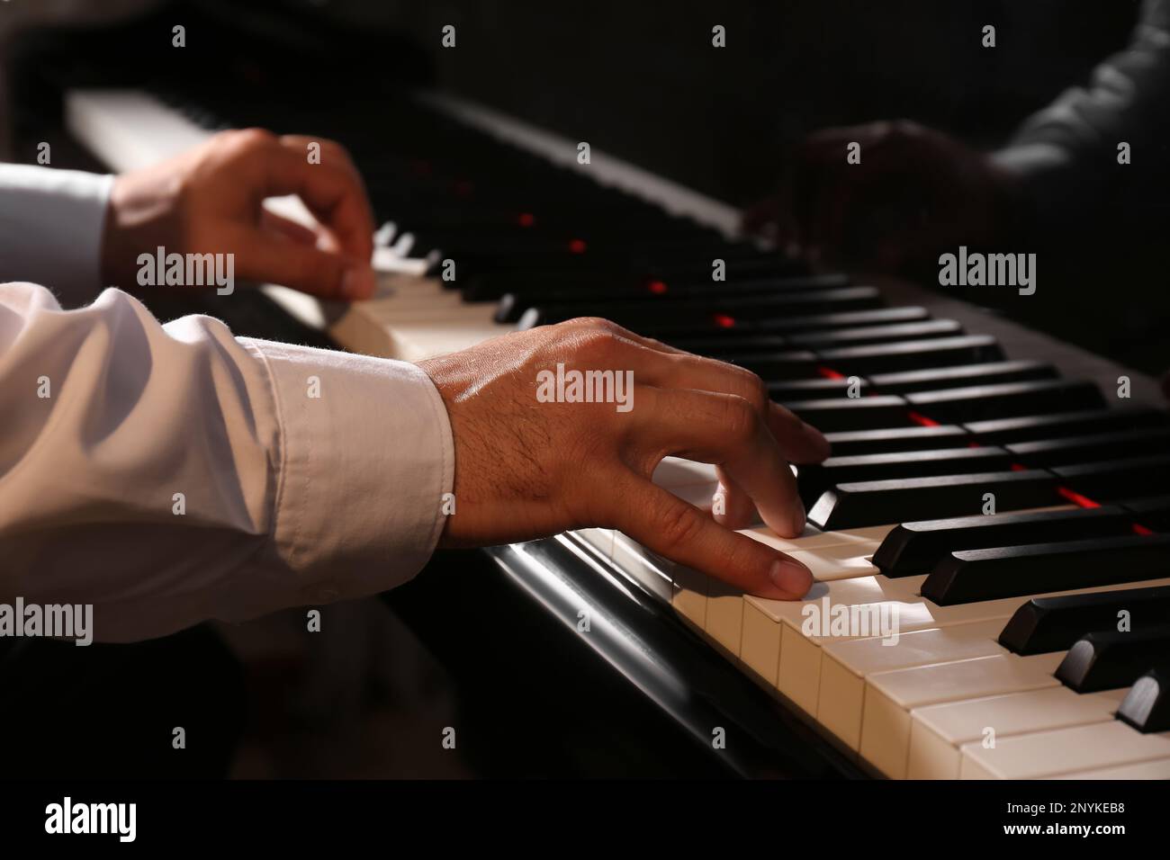 Man playing grand piano, closeup. Talented musician Stock Photo - Alamy