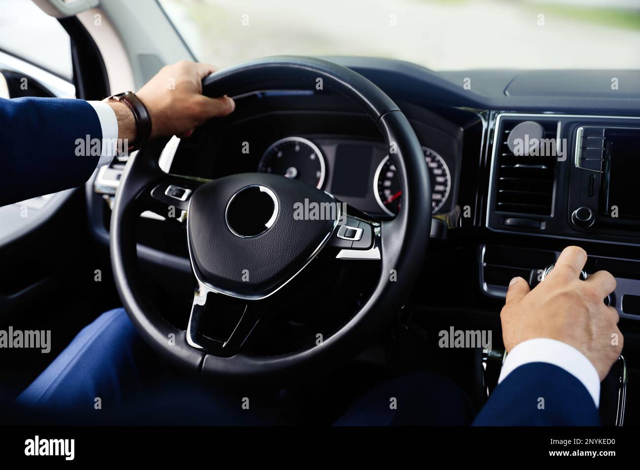 Man driving his car, closeup view of hands on steering wheel Stock ...