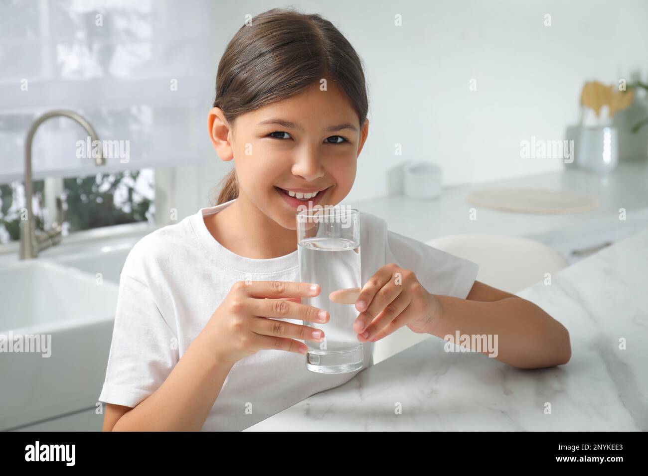 Girl drinking water from tap hi-res stock photography and images - Alamy