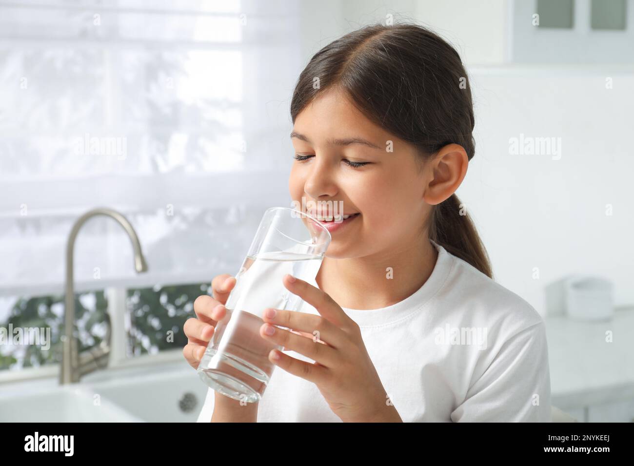 Child water kitchen tap glass hi-res stock photography and images - Alamy