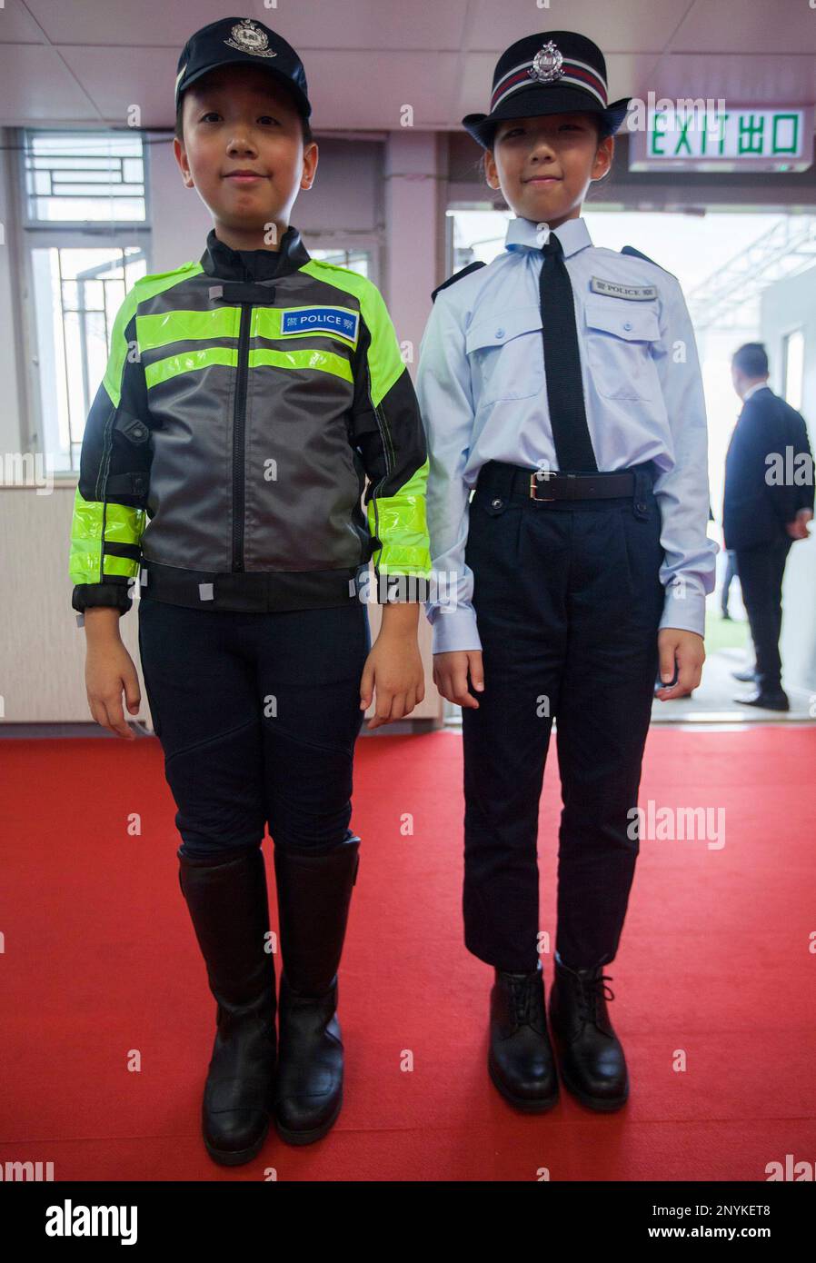 Members of the Hong Kong Police Force Junior Police Scheme stand to ...