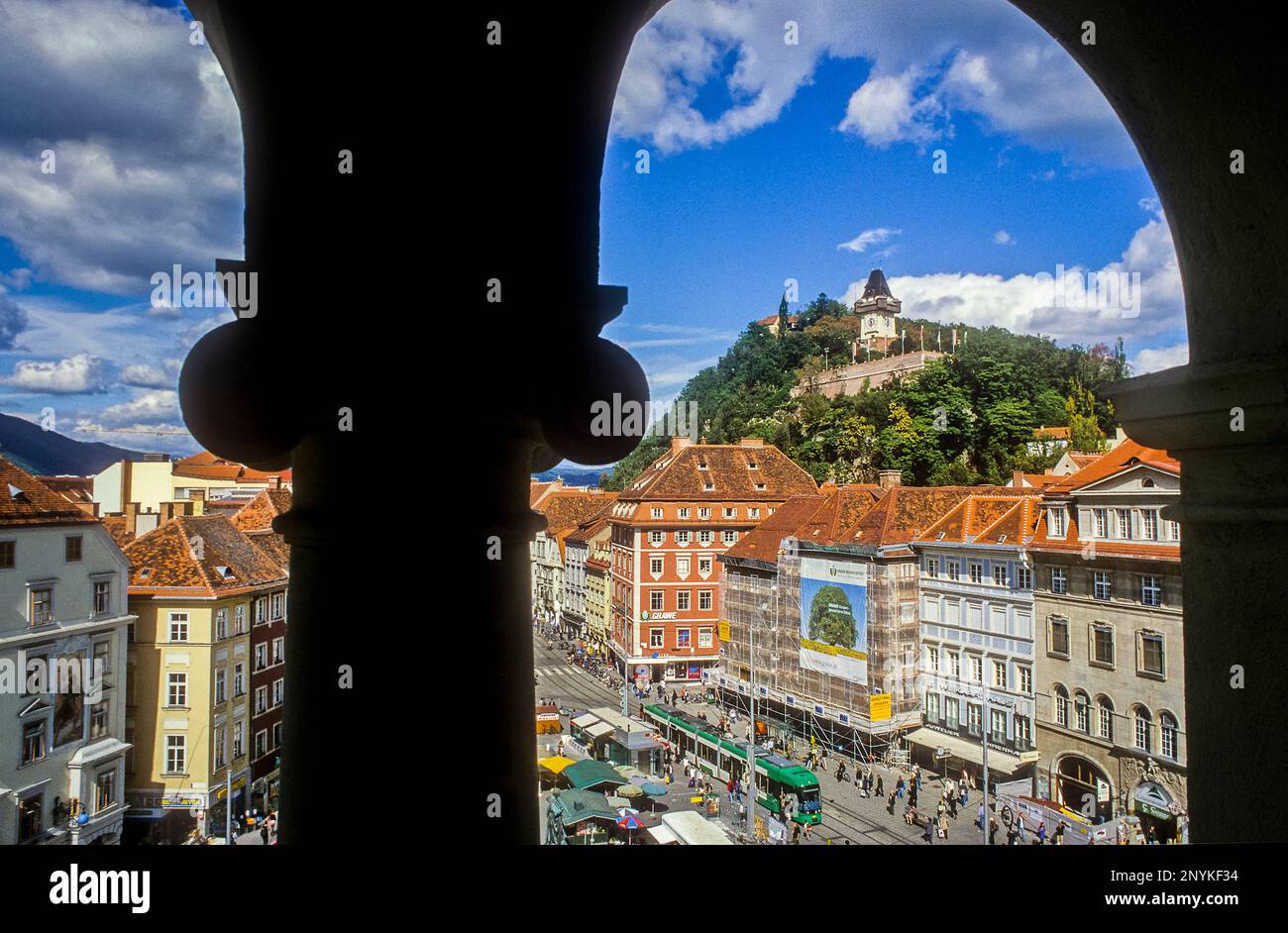 Cityscape with Schlossberg or Castle Hill mountain with old clock tower ...
