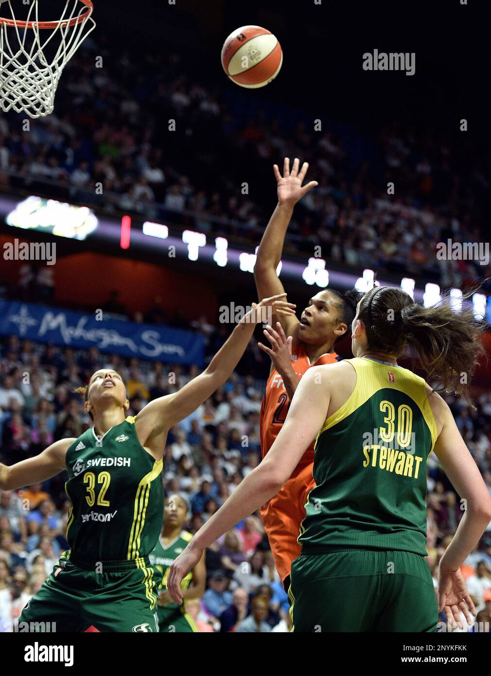Connecticut Sun's Alyssa Thomas scores over Seattle Storm's Alysha ...