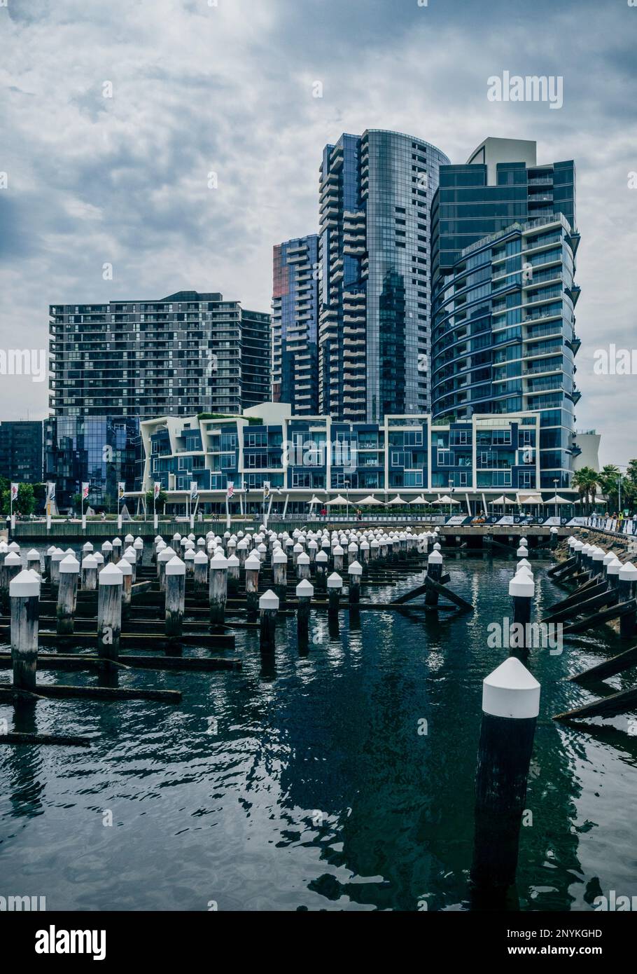 Modern buildings rising above harbour at the Docklands, Melbourne ...