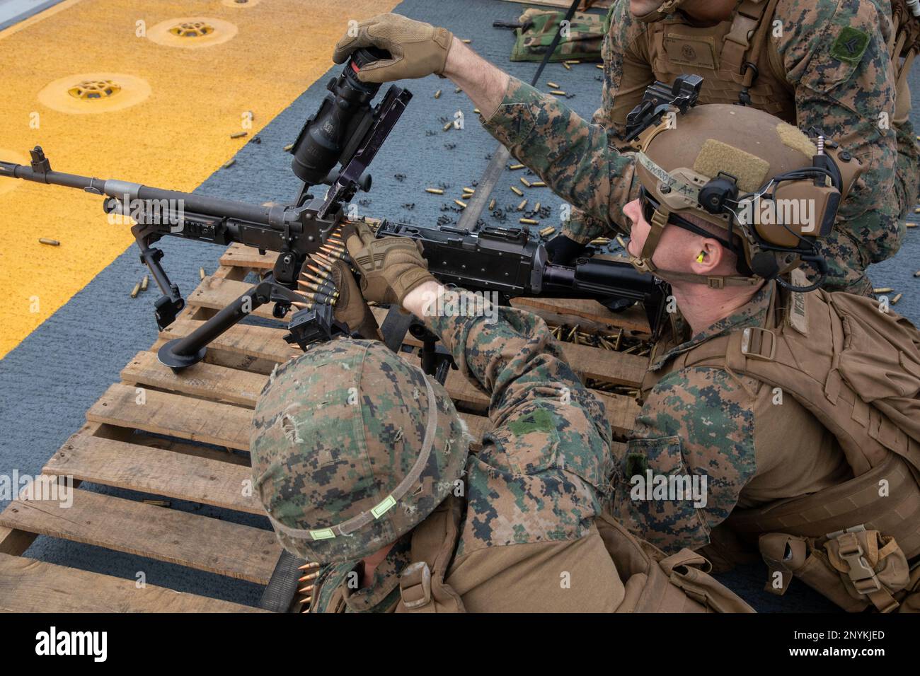 PACIFIC OCEAN (Jan. 3, 2023) - U.S. Marines with 13th Marine Expeditionary Unit reload an M240B ...
