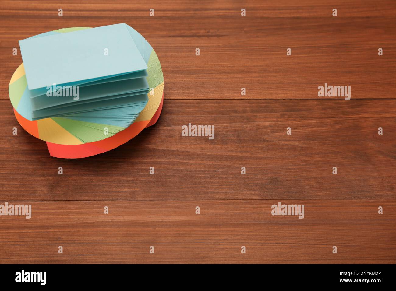 Stack of colorful stickers on wooden table, space for text Stock Photo ...