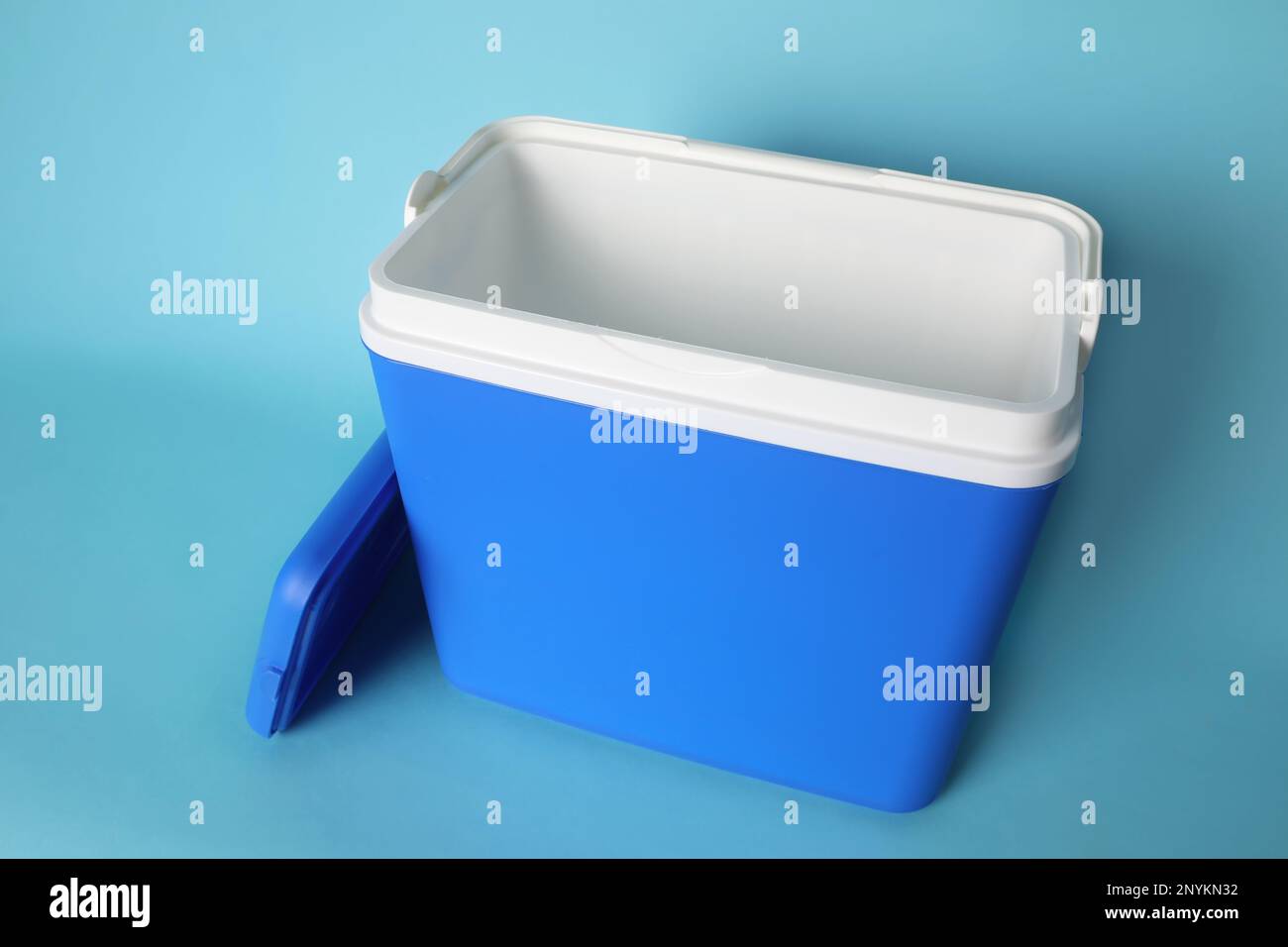 Open blue plastic cool box on turquoise background Stock Photo - Alamy