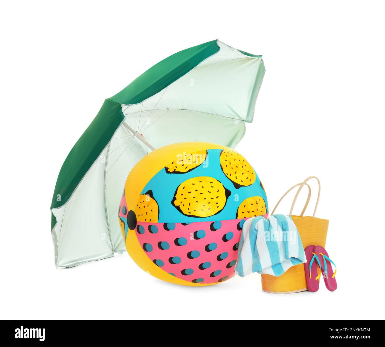 Open green beach umbrella, inflatable ball and accessories on white ...
