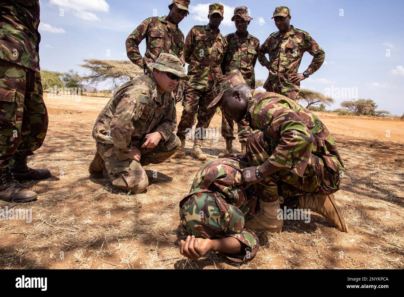 A soldier from the Kenyan Defence Forces checks a notional casualty for injuries during a ...