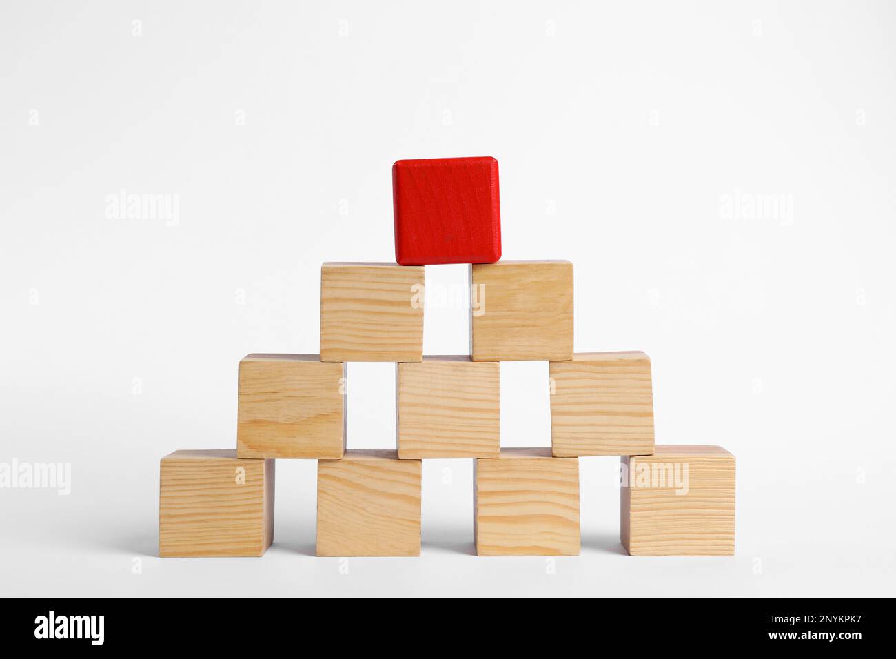 Blank wooden cubes and red one stacked on white background Stock Photo ...