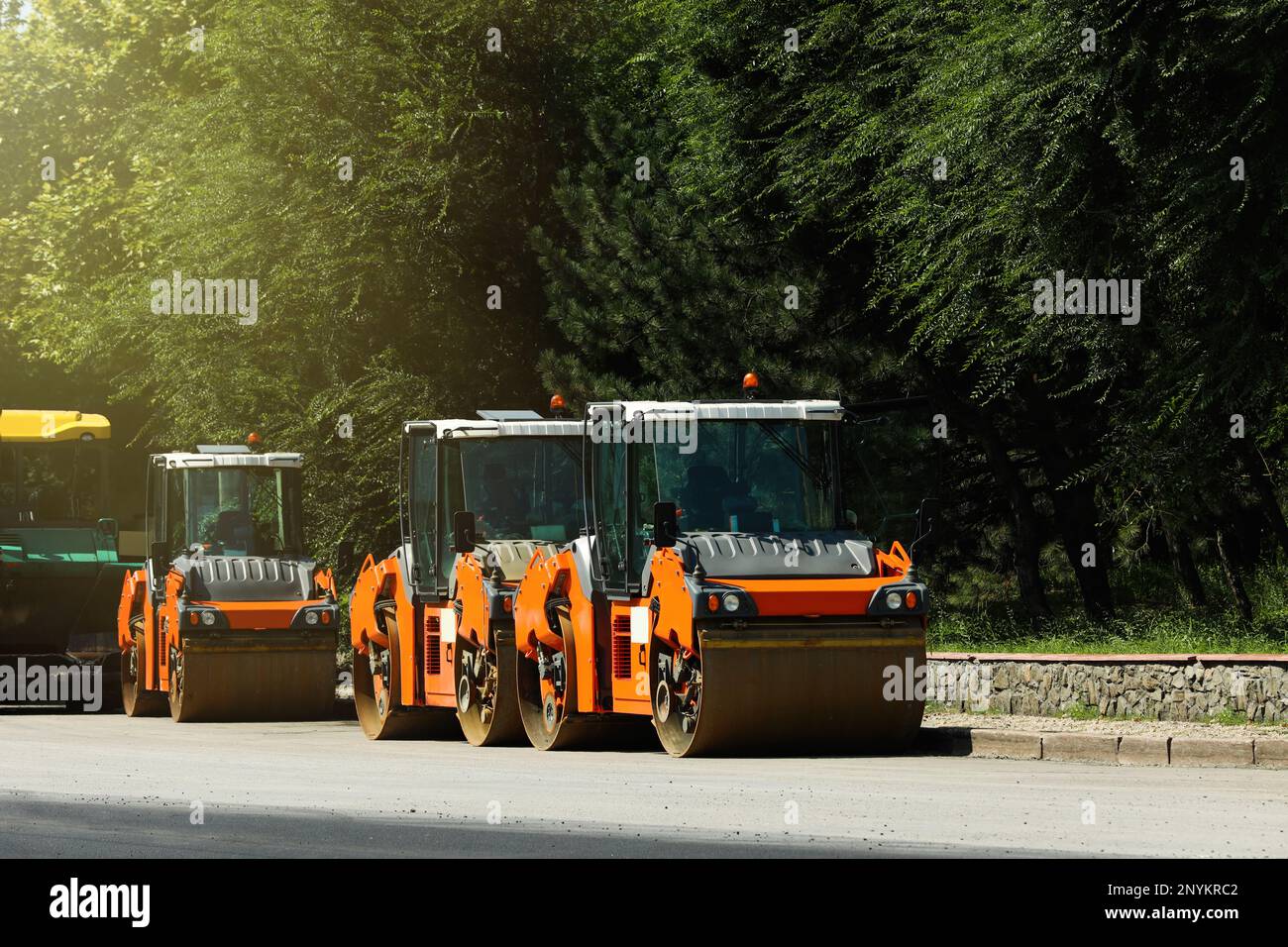 Modern rollers on city street. Road repair service Stock Photo - Alamy