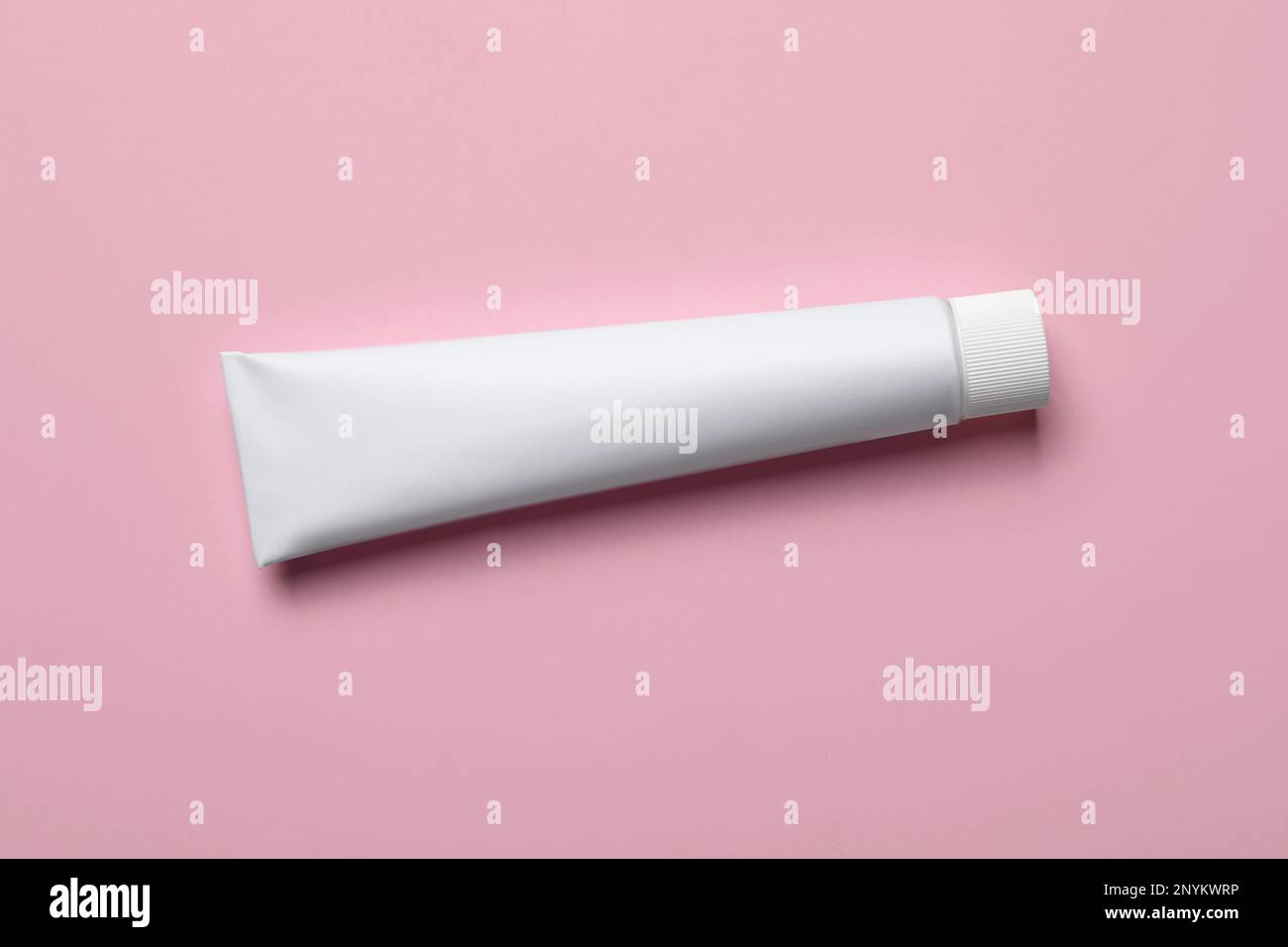Blank tube of toothpaste on pink background, top view Stock Photo - Alamy