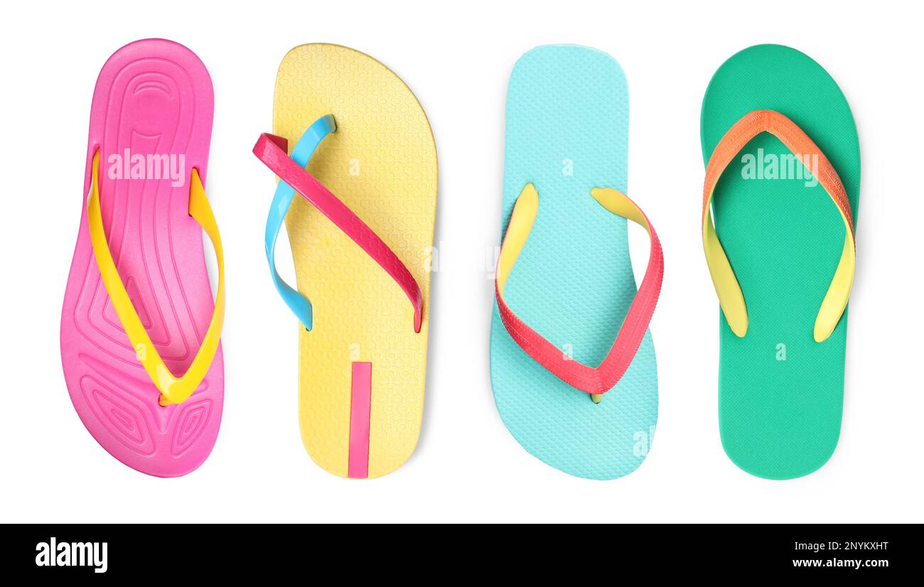 Set with different colorful flip flops on white background, top view ...