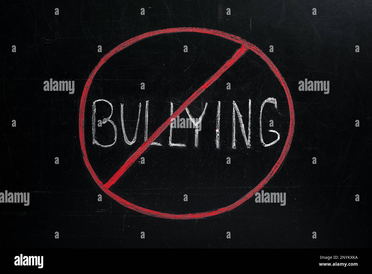 Prohibition sign with word Bullying chalked on blackboard Stock Photo ...
