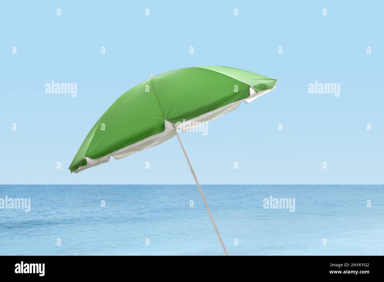 Open big beach umbrella near sea on sunny day Stock Photo - Alamy