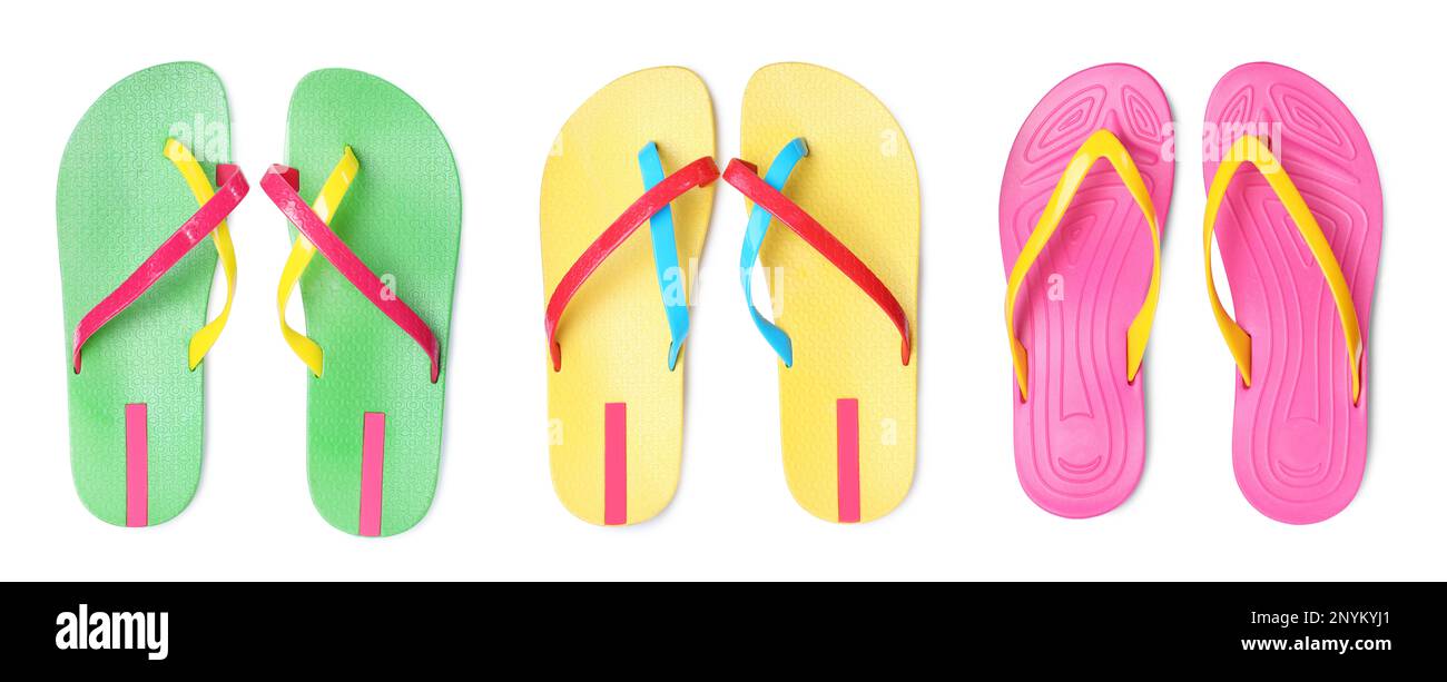 Set with different colorful flip flops on white background, top view ...