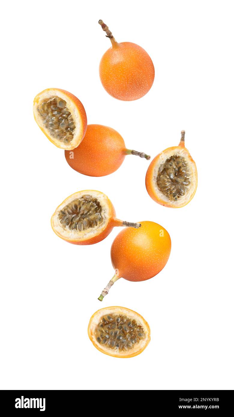 Delicious ripe granadillas falling on white background Stock Photo - Alamy