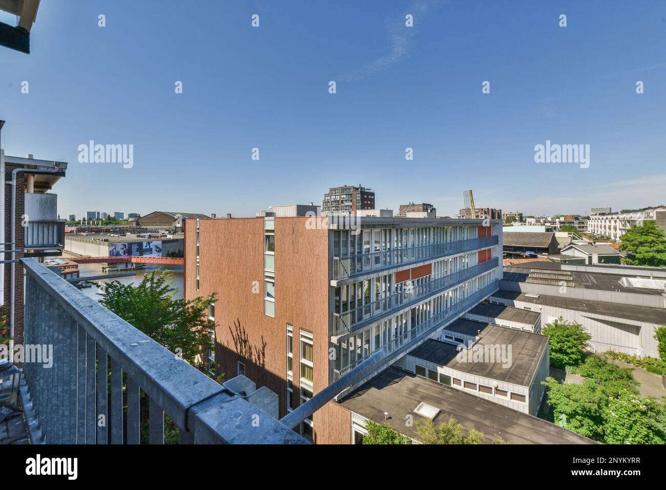 a city from the top of a building, with buildings in the background and ...