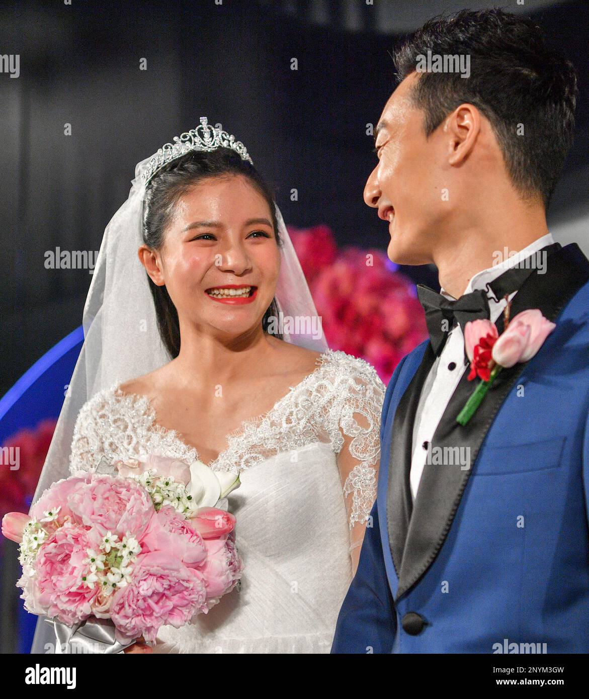 Chinese divers He Zi, left, and Qin Kai attend their wedding ceremony ...
