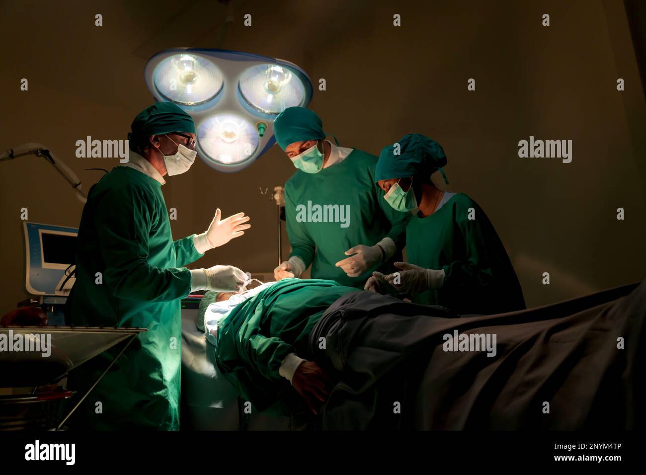 Team doctors operating room dressed green uniforms saving lives ...