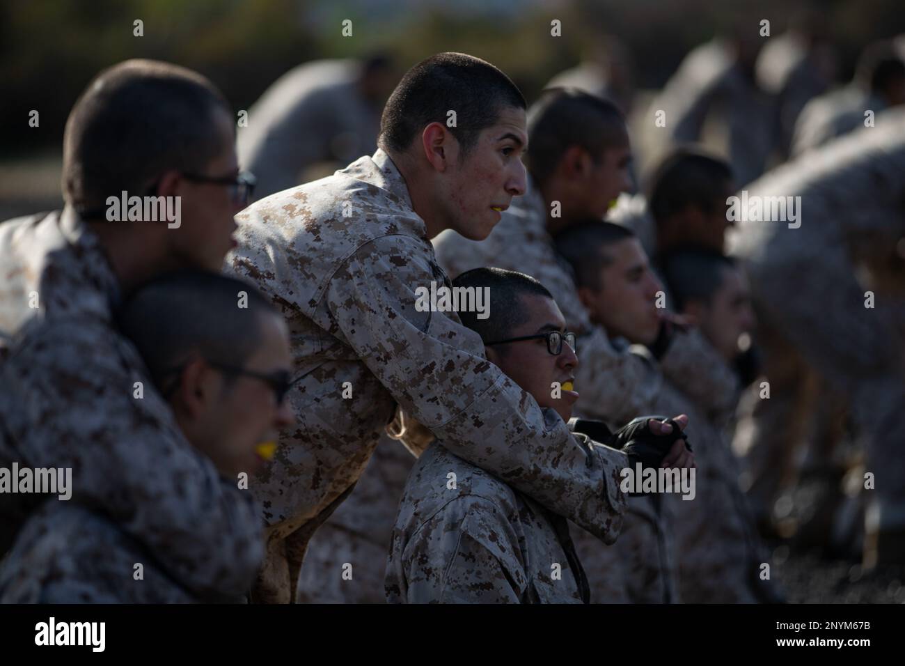 U.S. Marine Corps recruits with Kilo Company, 3rd Recruit Training Battalion, execute techniques ...