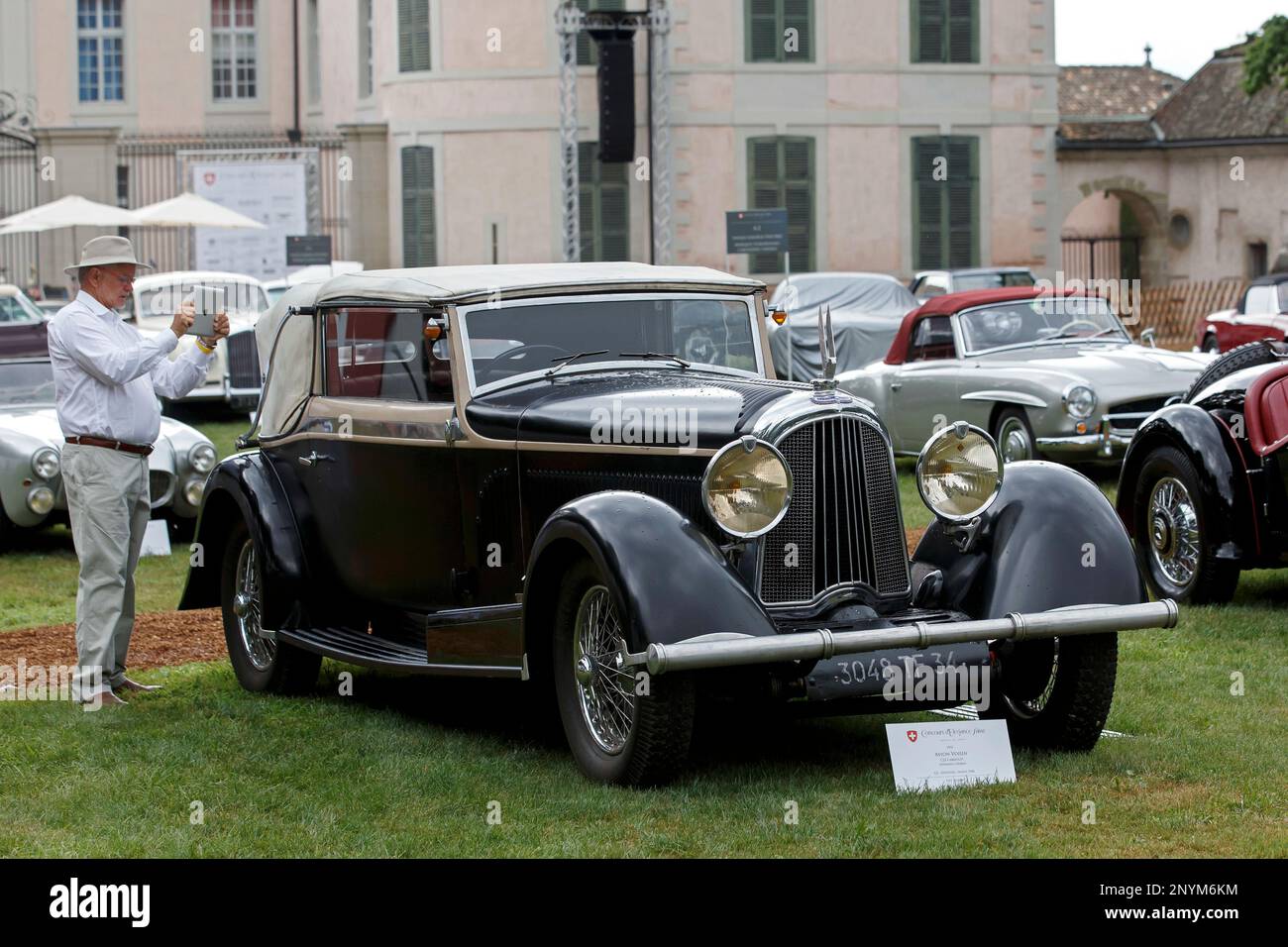 A visitor takes a picture of the car Avion Voisin C23 convertible of ...