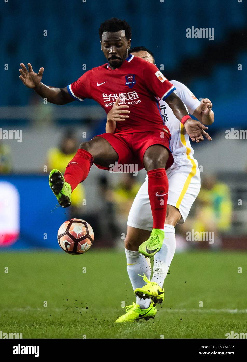 Brazilian football player Fernandinho, front, of Chongqing Dangdai ...