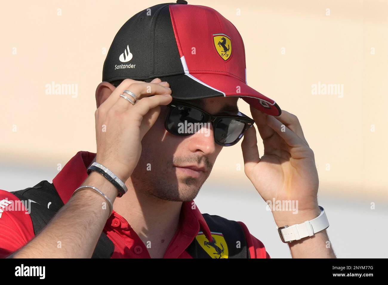 Ferrari driver Charles Leclerc of Monaco adjusts his sun glasses at the ...