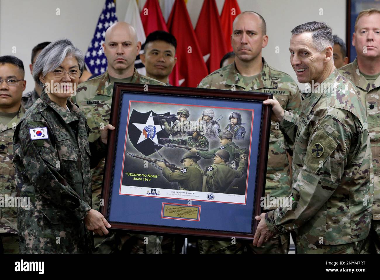 South Korean Foreign Minister Kang Kyung-wha, left, receives a gift ...