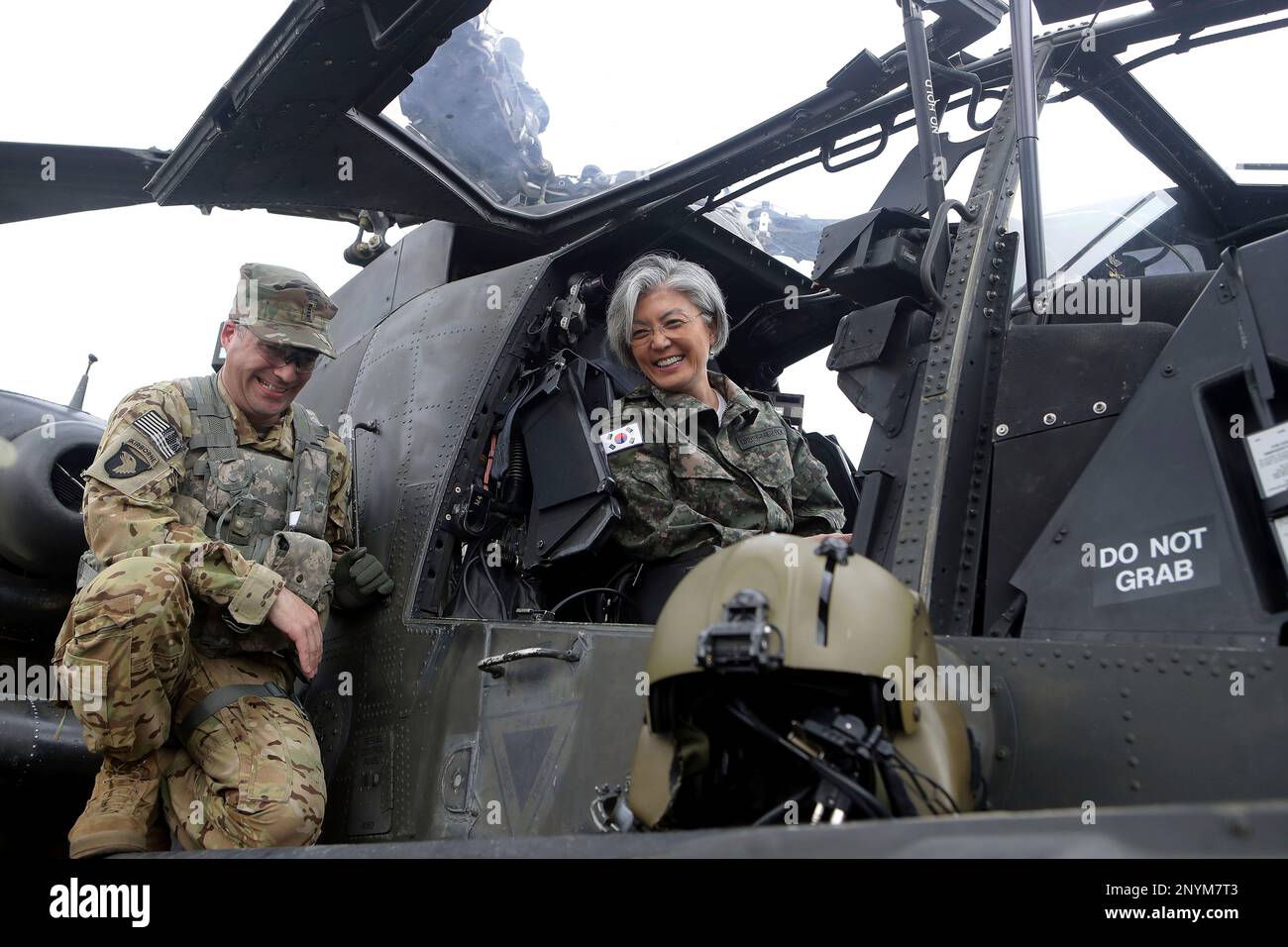 South Korean Foreign Minister Kang Kyung-wha, right, sits in a AH-64D ...